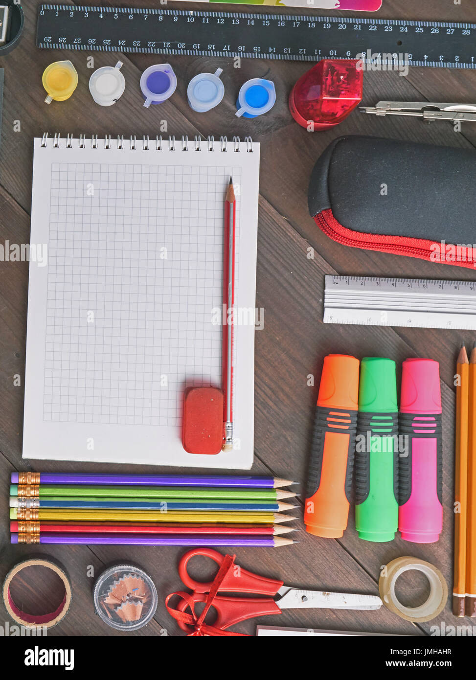flat lay school tools on a desk. with colorful pencils, markers, paints ...