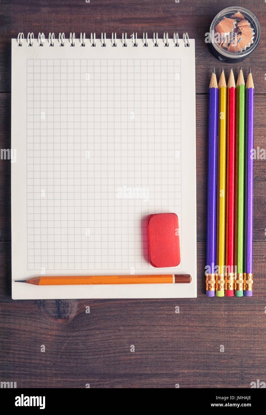 aerial top view of binder copybook with vivid colorful pencils ...