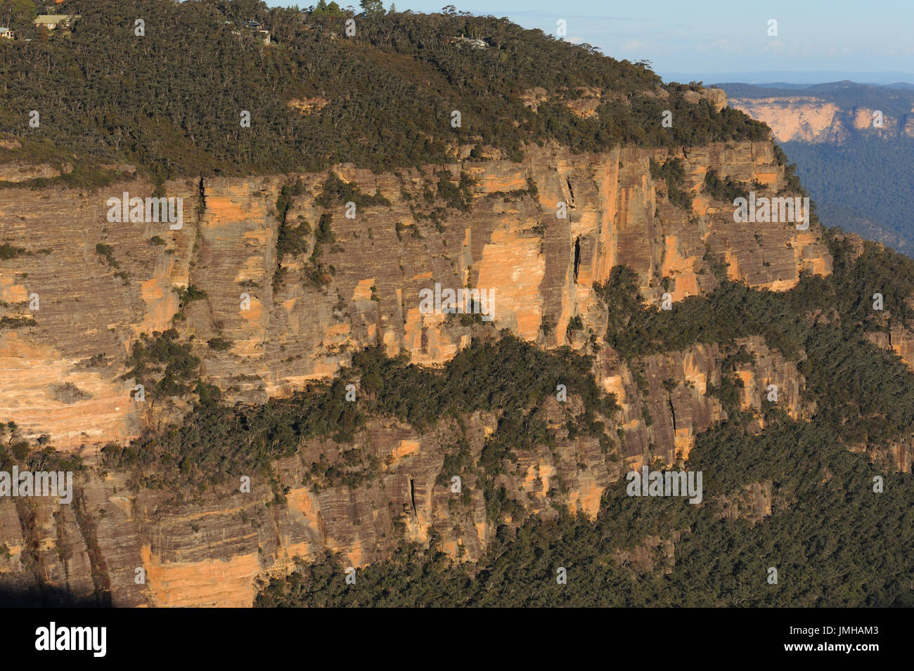 View of sublime point sandstone cliff face from Gordon Falls. Blue ...