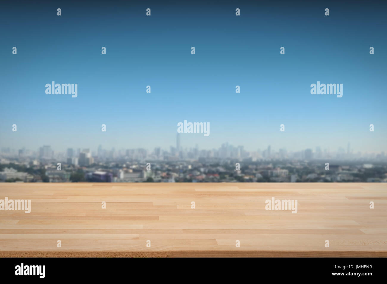 wooden counter with cityscape and blue sky background Stock Photo - Alamy