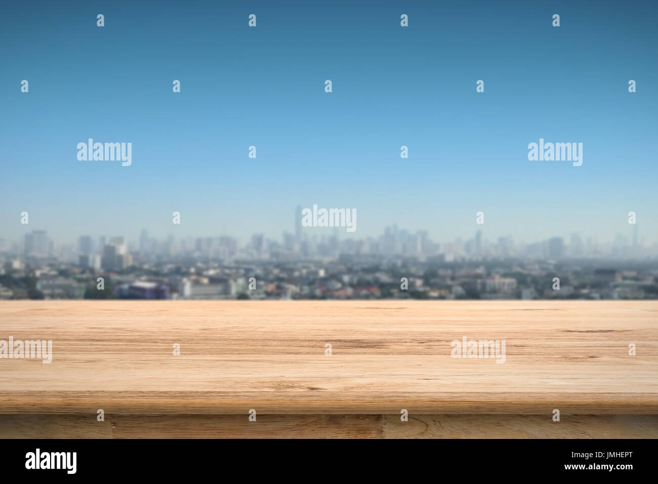 wooden counter with cityscape and blue sky background Stock Photo - Alamy