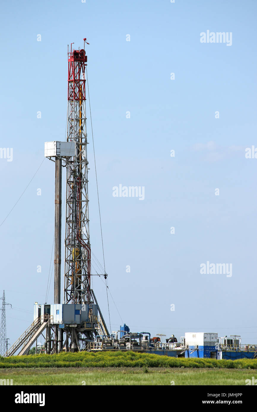 oil drilling rig with equipment on field Stock Photo - Alamy
