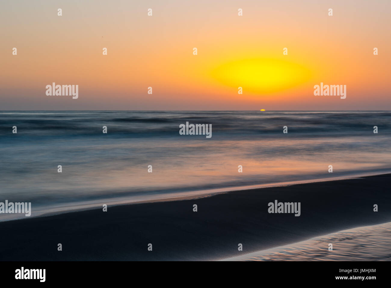 Bright colorful sunrise at sea Stock Photo - Alamy