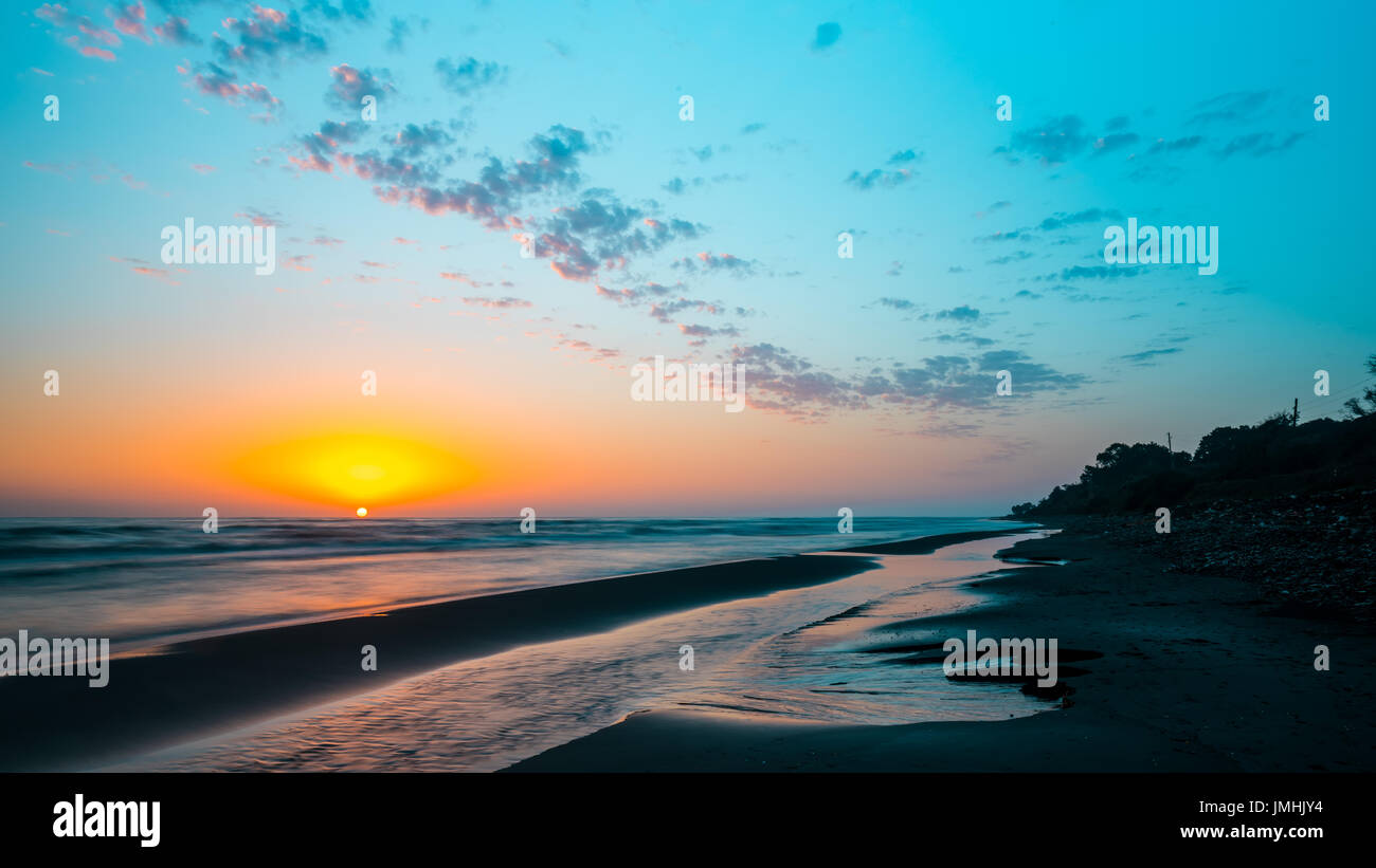 Bright colorful sunrise at sea Stock Photo - Alamy