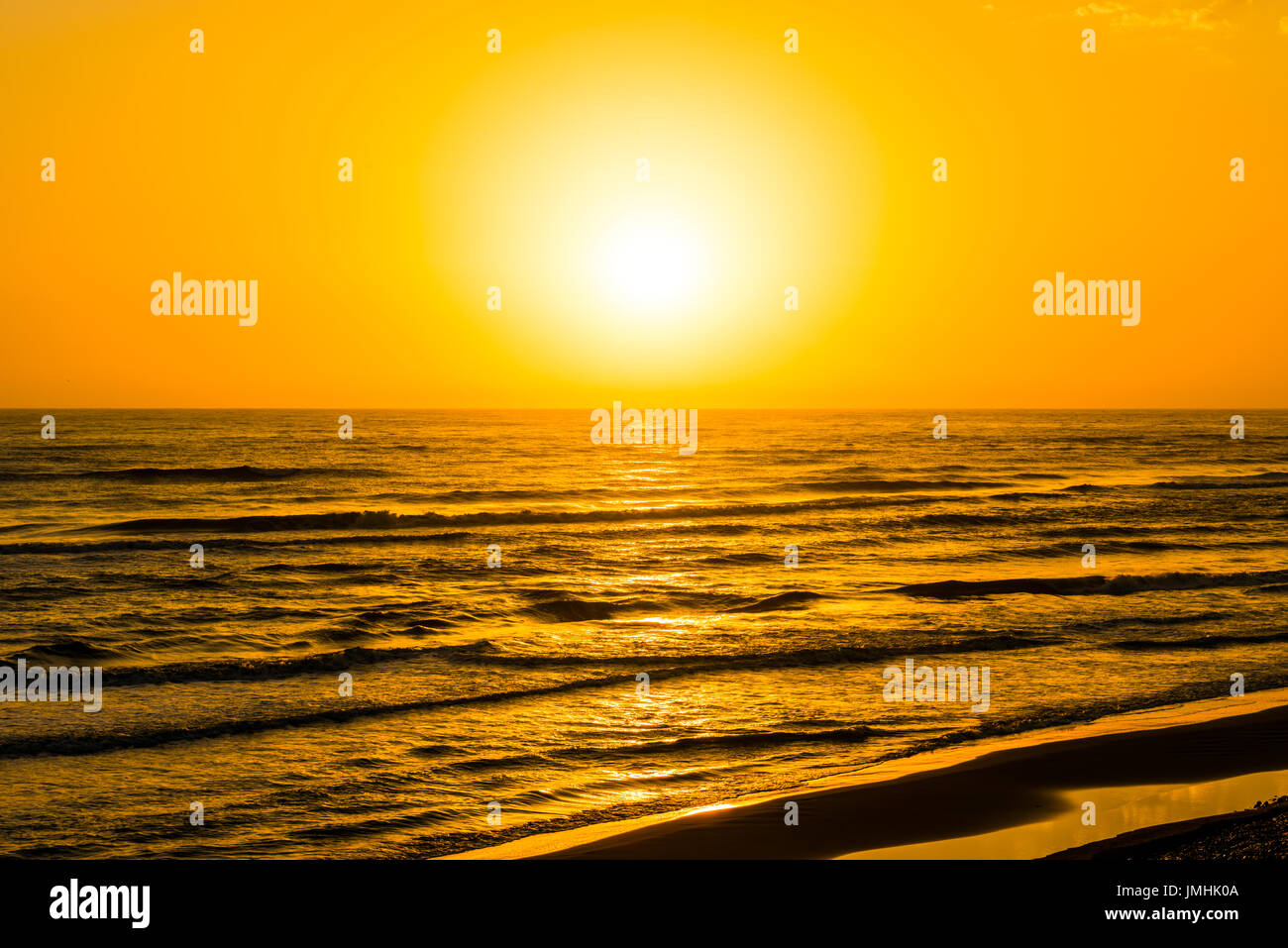 Bright colorful sunrise at sea Stock Photo - Alamy