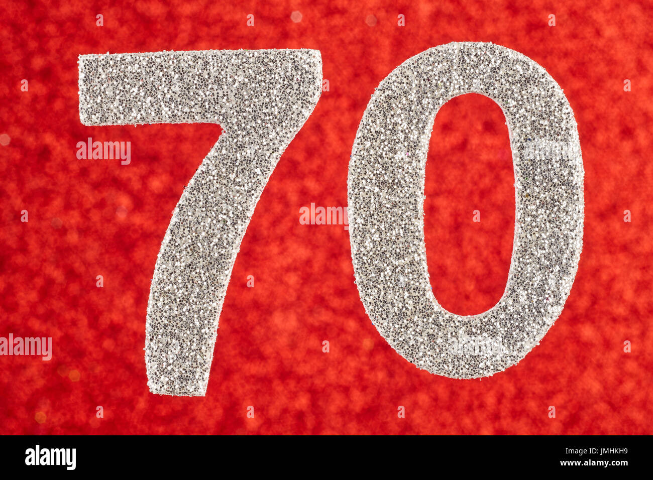 Number seventy silver color over a red background. Anniversary ...
