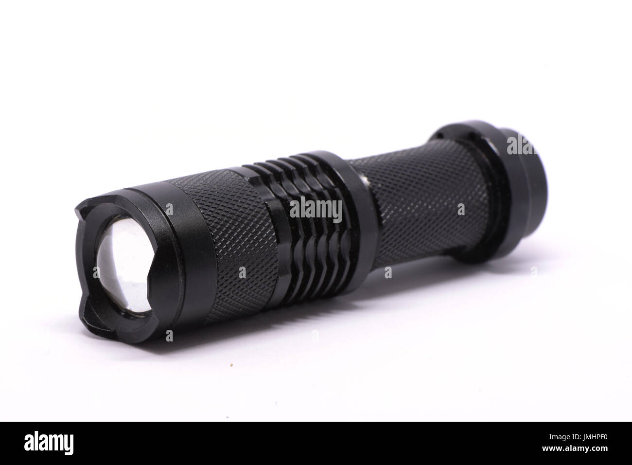 Isolated black flashlight on white background Stock Photo - Alamy