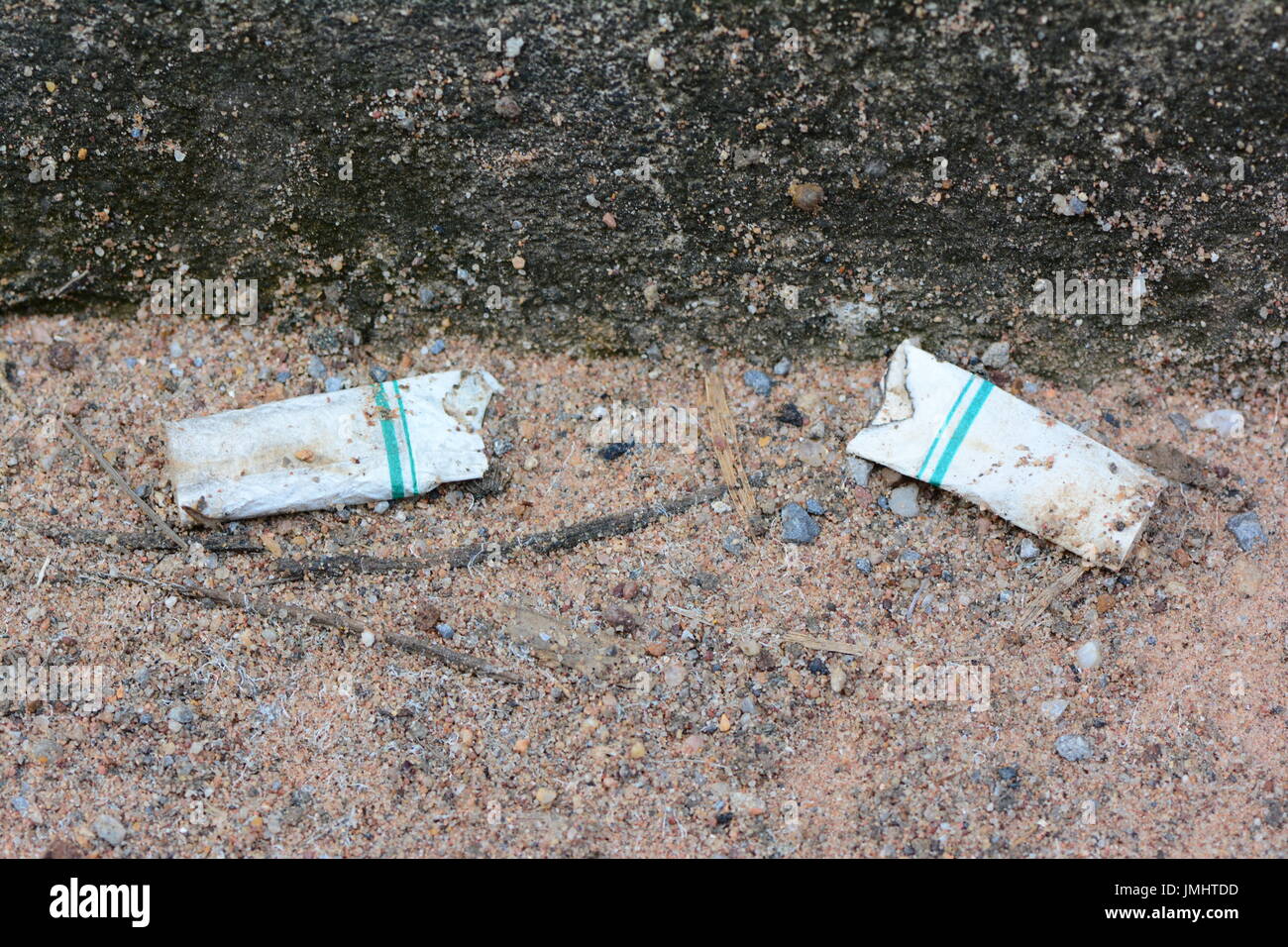 Couple of used cigarette on the floor Stock Photo - Alamy