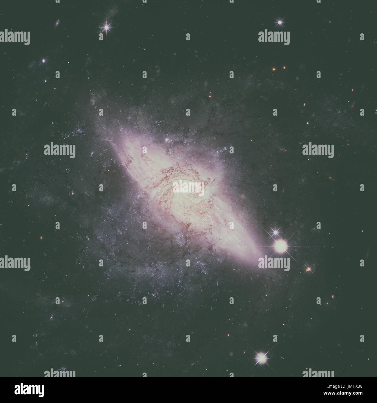 NGC 3314 is a pair of overlapping spiral galaxies between 117 and 140 million light-years away ...