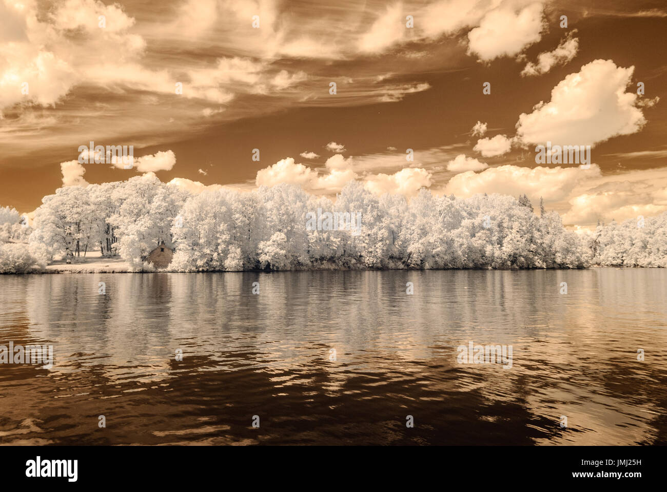 infrared camera image. colored. reflections of clouds in water in ...