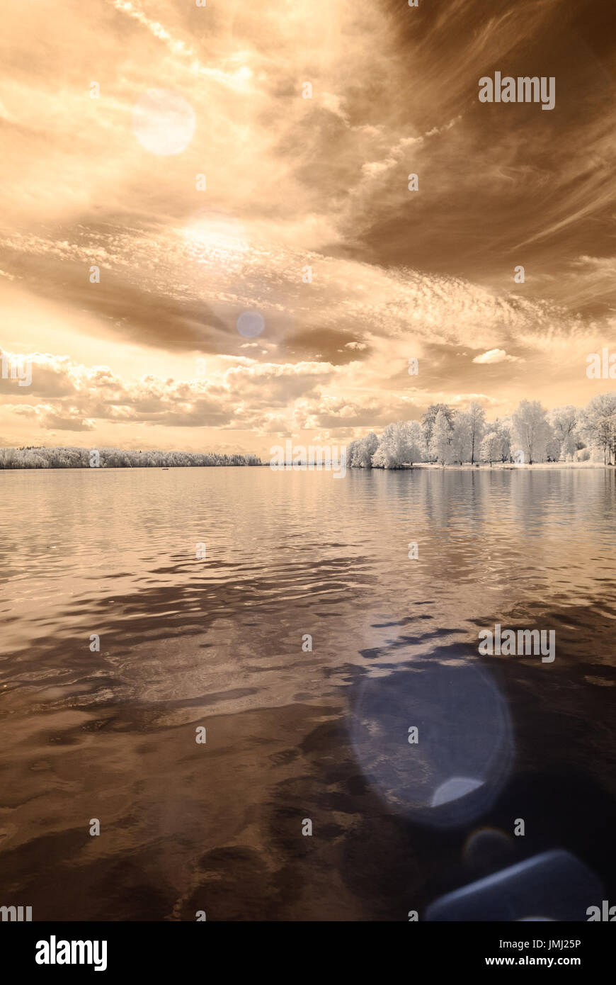 infrared camera image. colored. reflections of clouds in water in ...