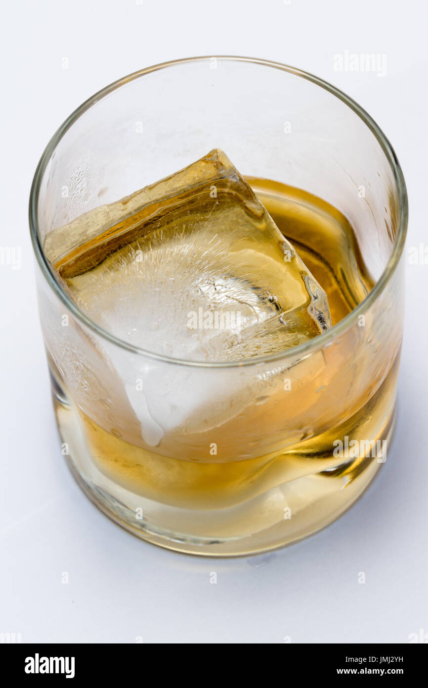 blended scotch whiskey served in a short glass with a large ice cube ...