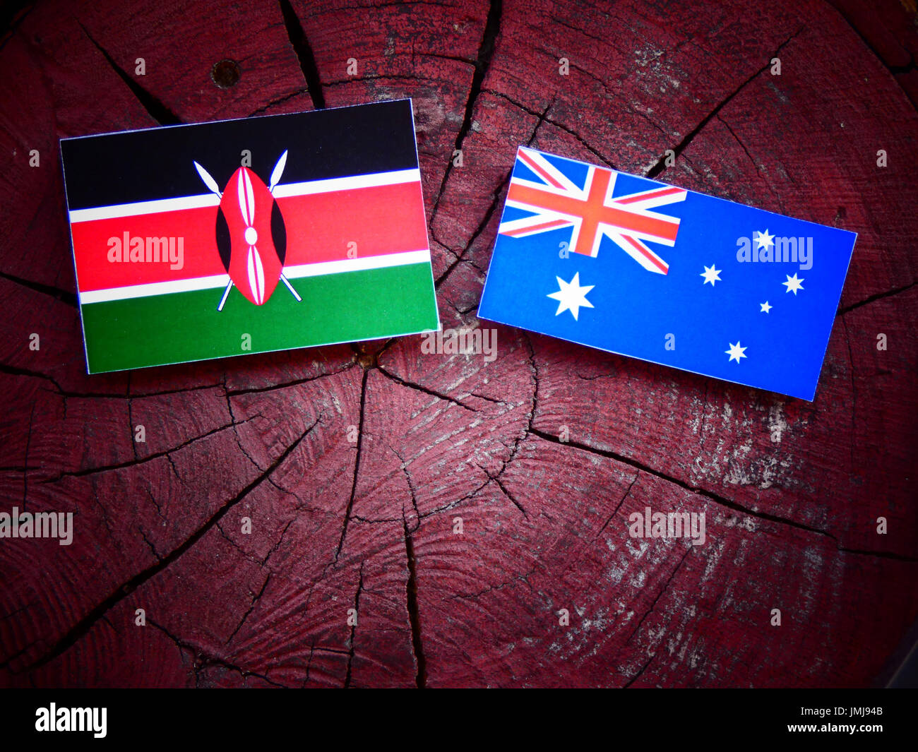 Kenyan flag with Australian flag on a tree stump isolated Stock Photo ...