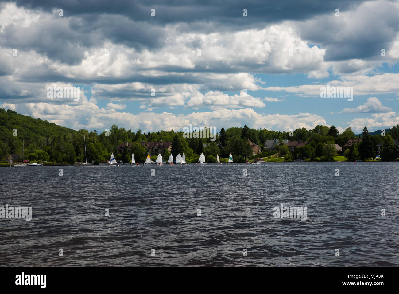 The beautiful landscape of Maskinonge Lake with sailors in the ...