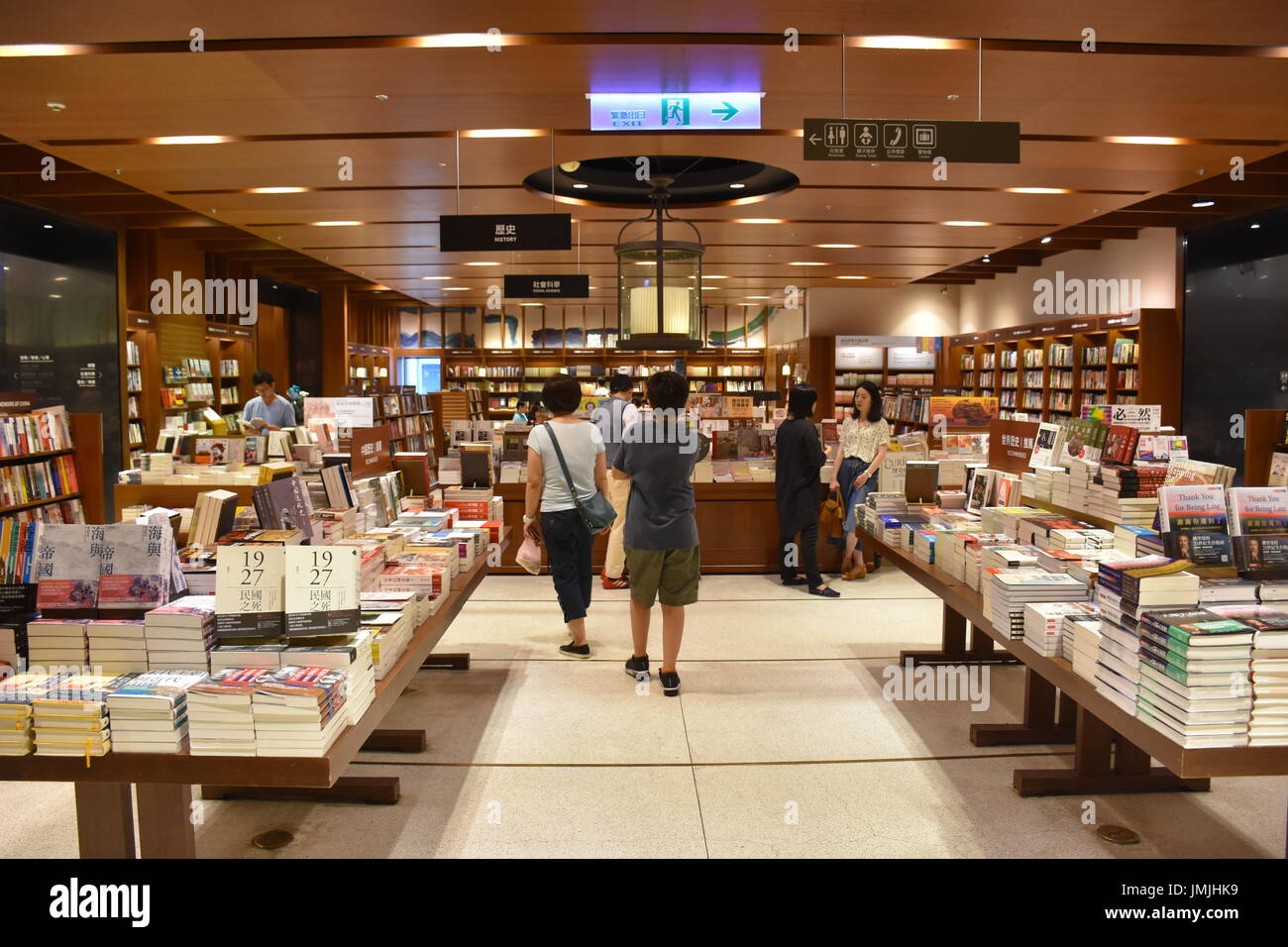 People searching for their favorite books in a bookstore in Taipei ...