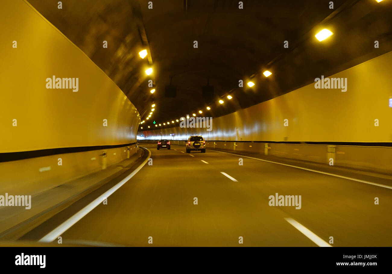 Driving car through a long tunnel on motorway Stock Photo - Alamy