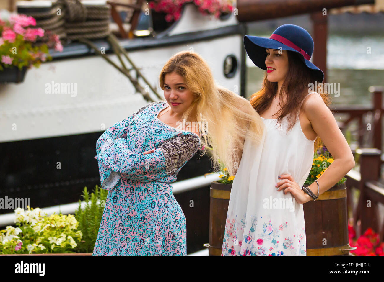 Two beautiful young women having fun on street of the city, Prague ...