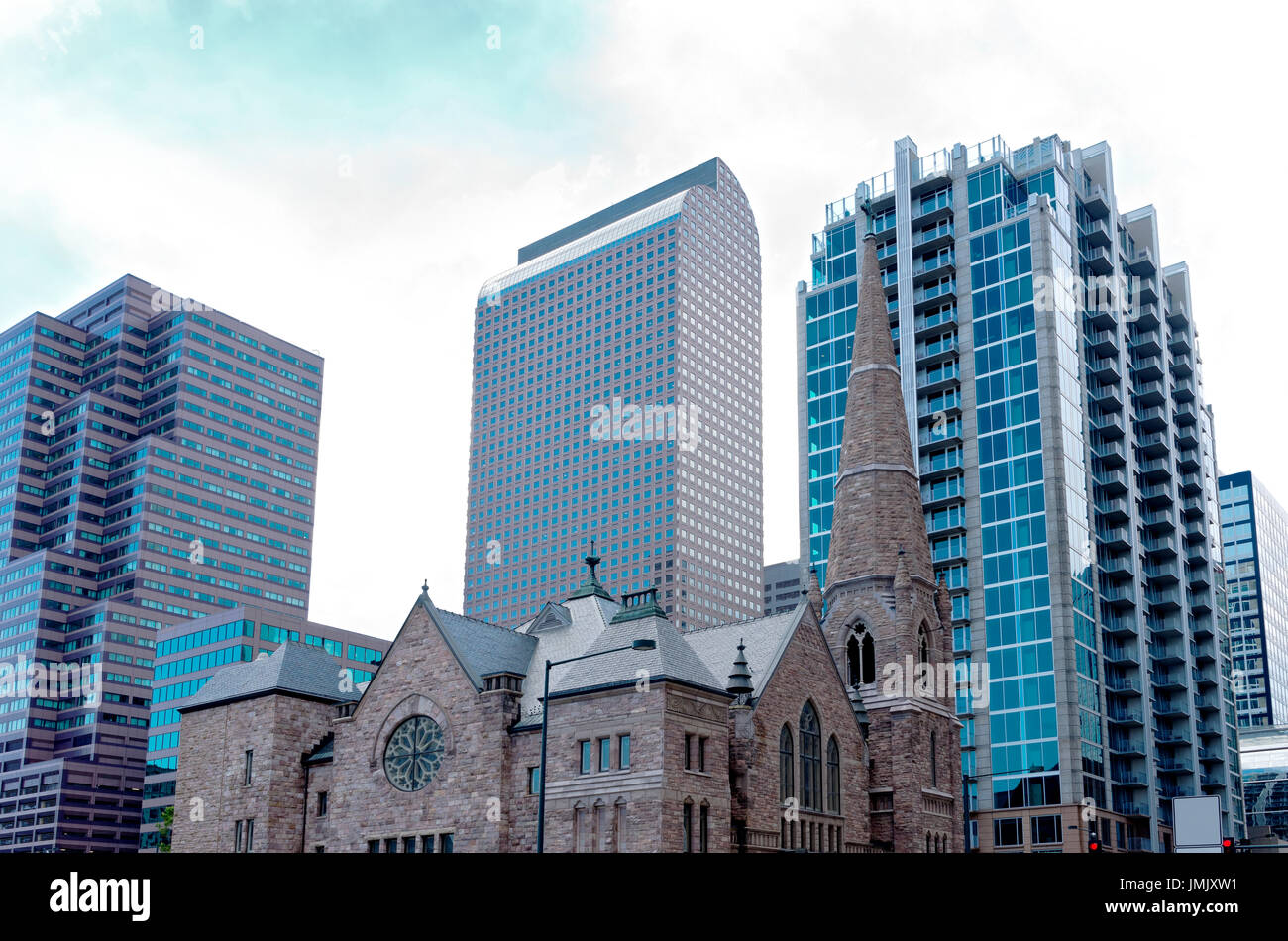 historic gothic church against skyline of modern skyscrapers in ...