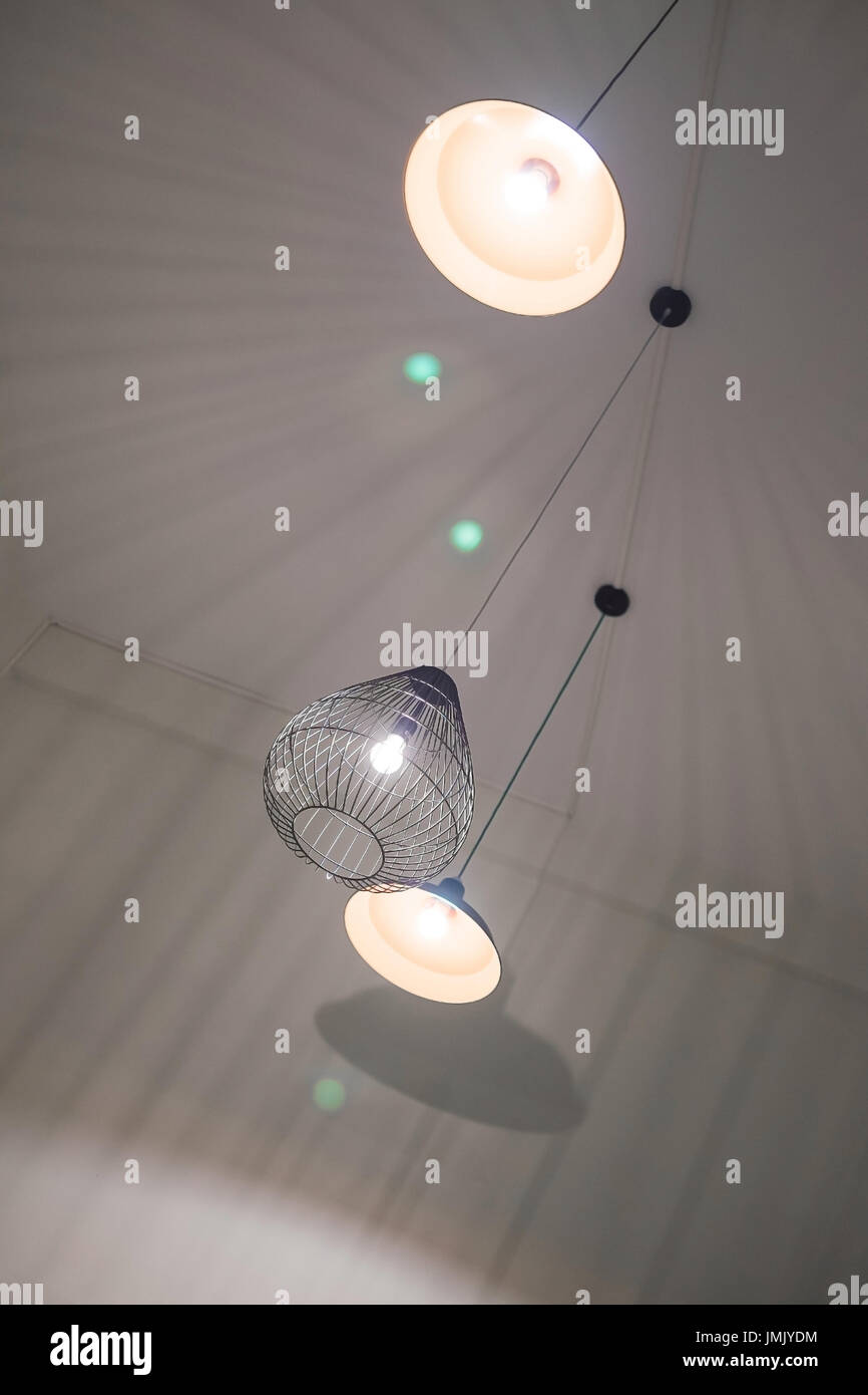 Modern ceiling lamps lighting equipment in dark room with shadow ...