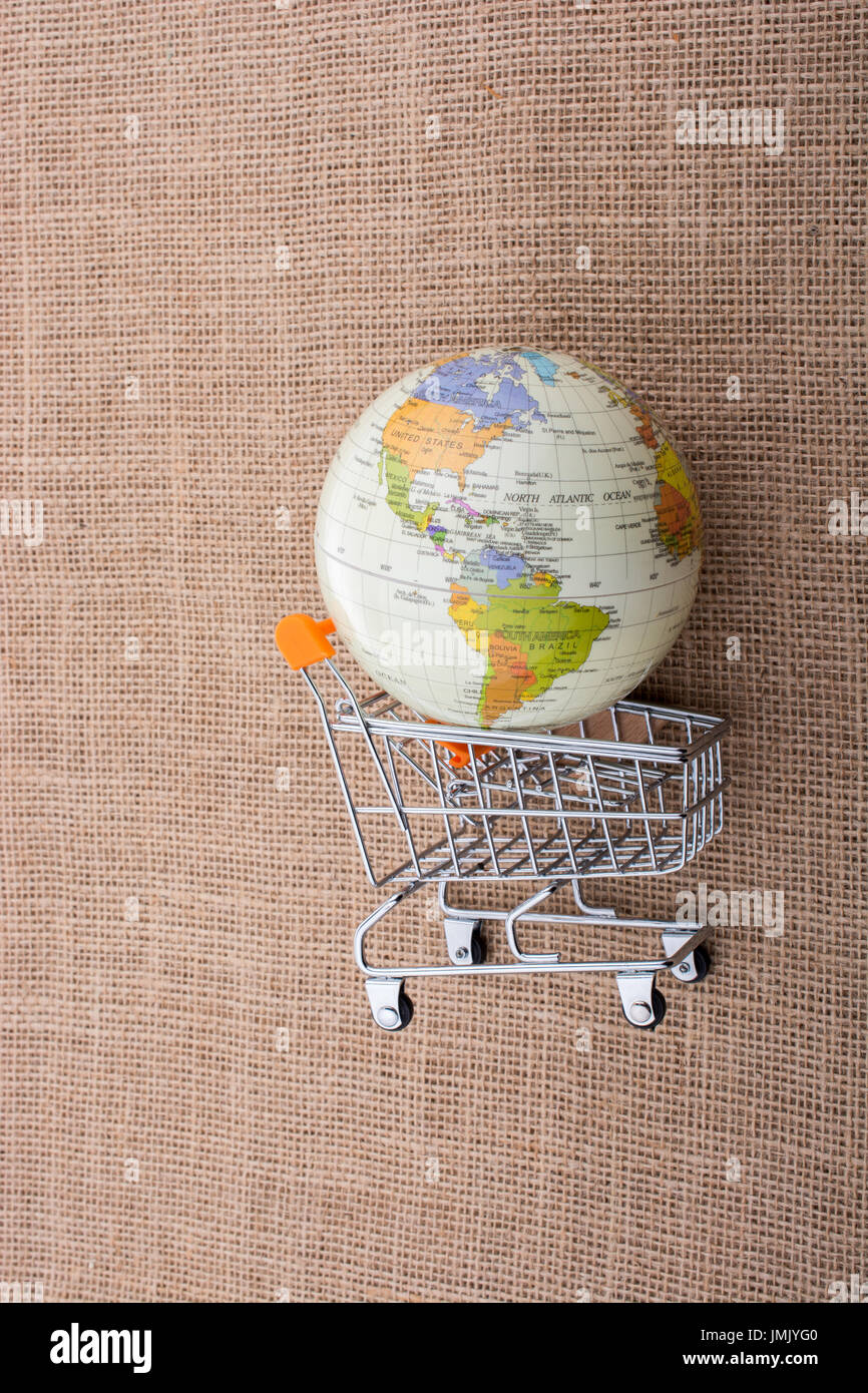 Globe in shopping trolley hi-res stock photography and images - Alamy