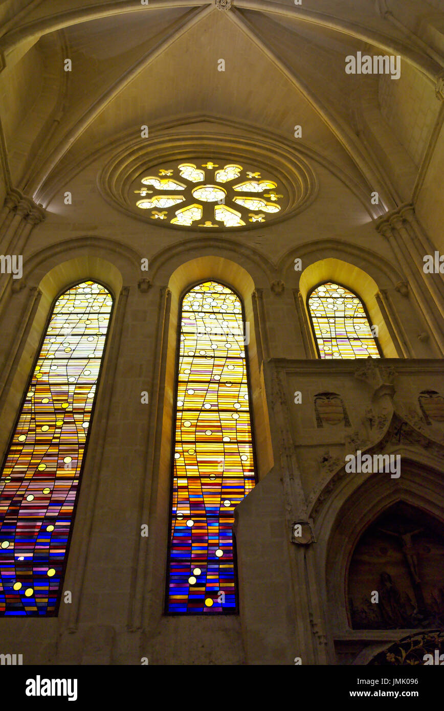 Vertical image showing rich colors stained-glass windows together with ...