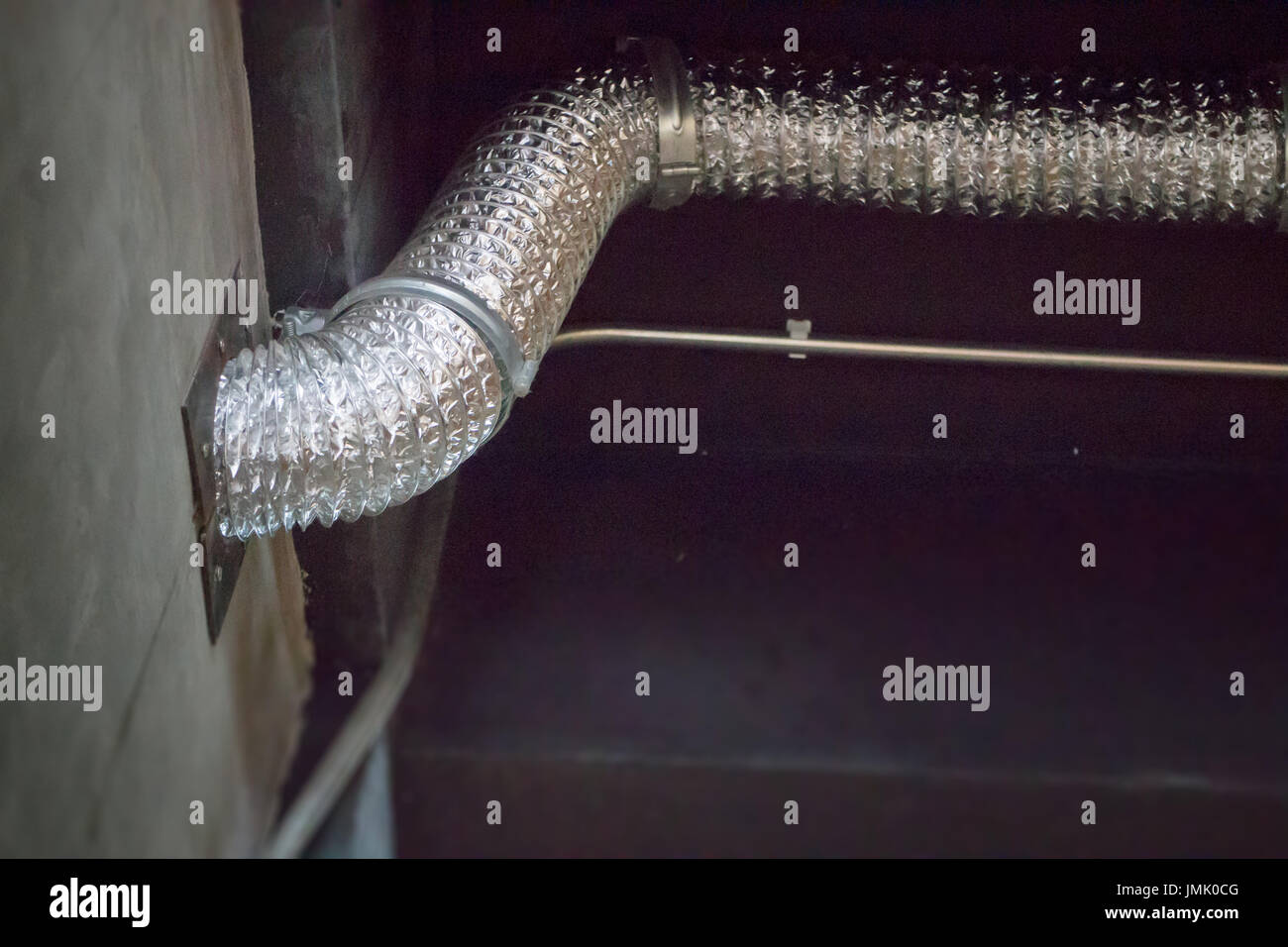 Air conditioner pipe on dark ceiling, stock photo Stock Photo - Alamy