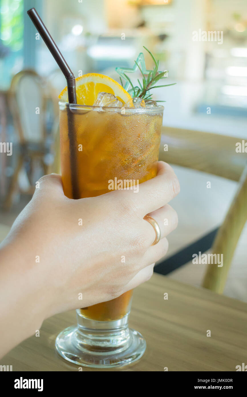 Hand on iced lemon tea, stock photo Stock Photo - Alamy