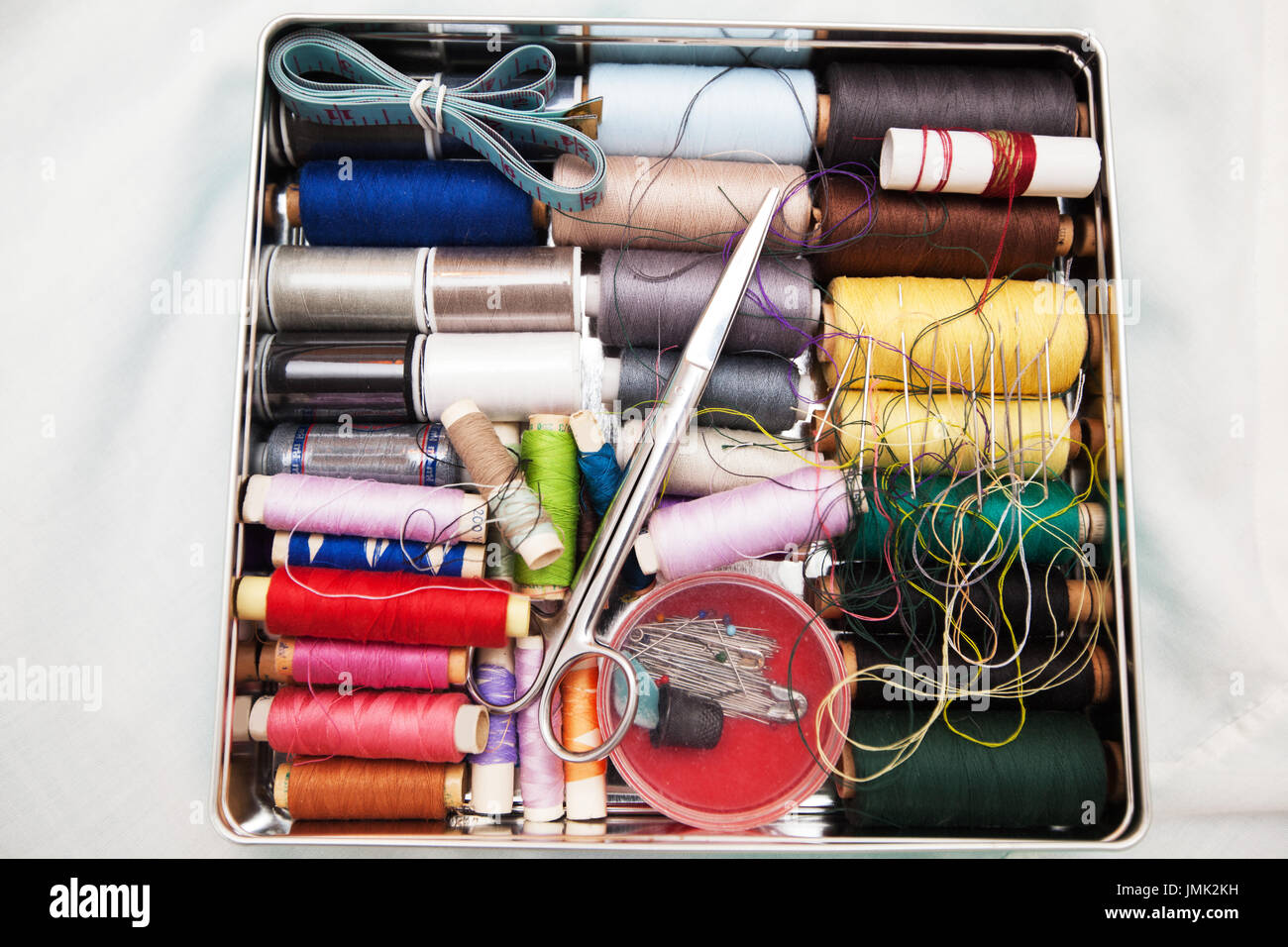 Sewing kit with scissors in the box Stock Photo - Alamy