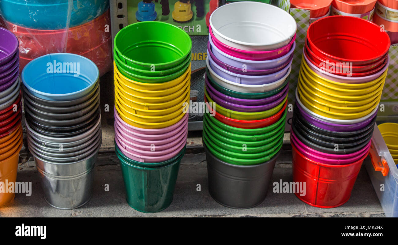 Little set of buckets of various colors in a market place Stock Photo ...