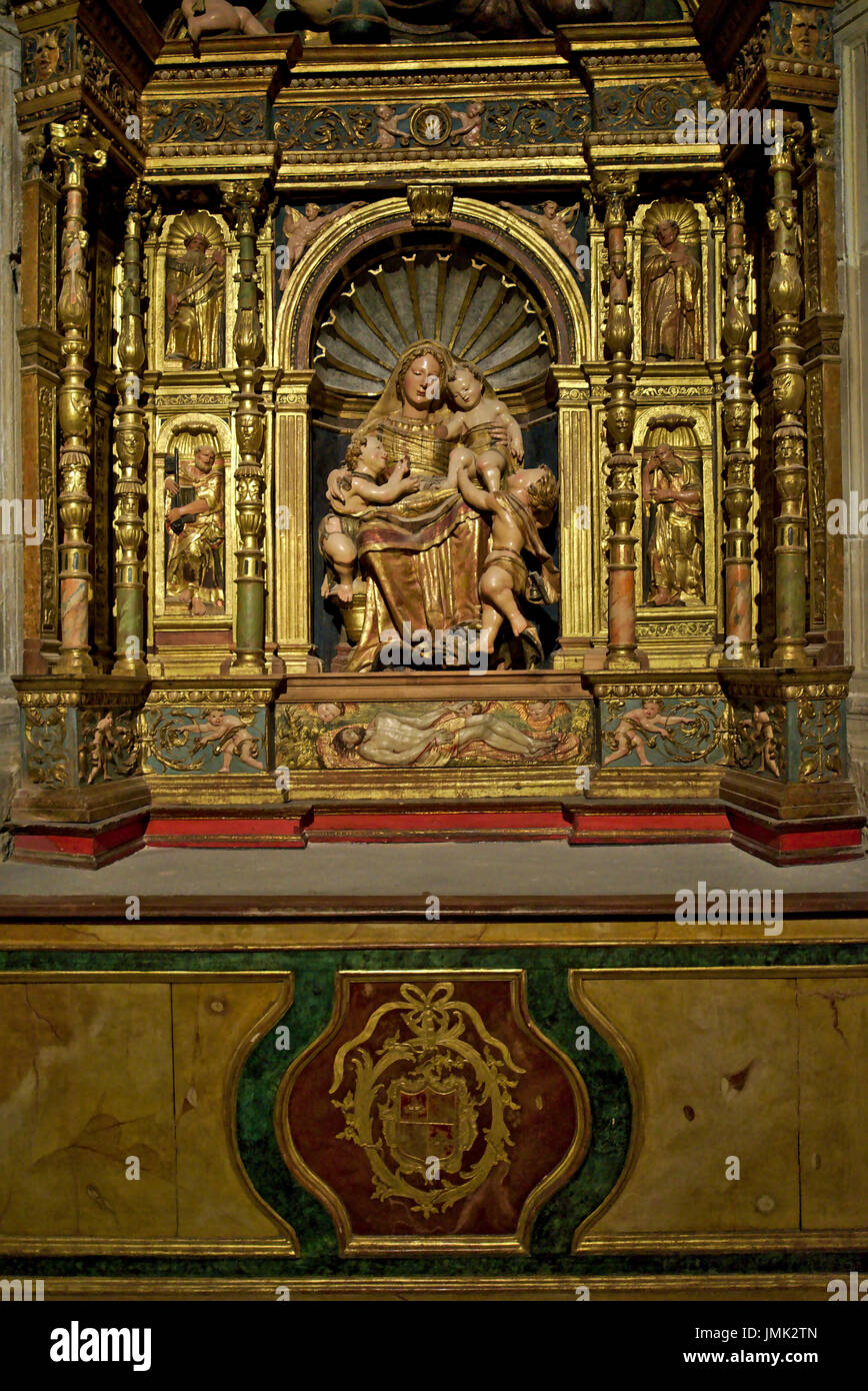 Catholic golden altarpiece with image of Saint Mary together with the ...