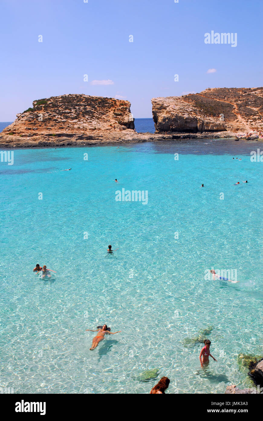 Swimming in the beautiful blue lagoon,Comino island,Malta Stock Photo ...