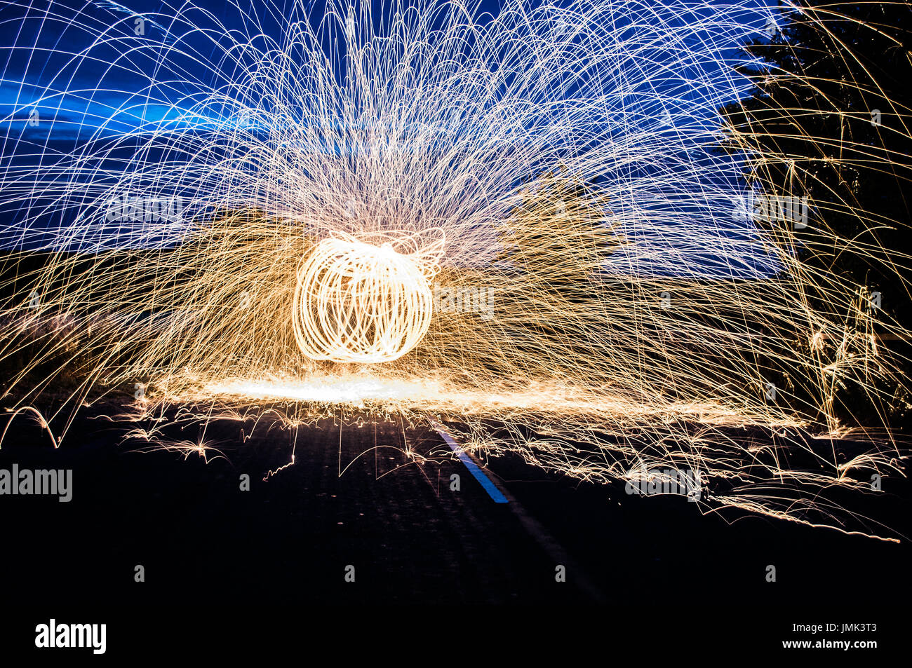 Long exposure burning steel wool shot at night Stock Photo - Alamy