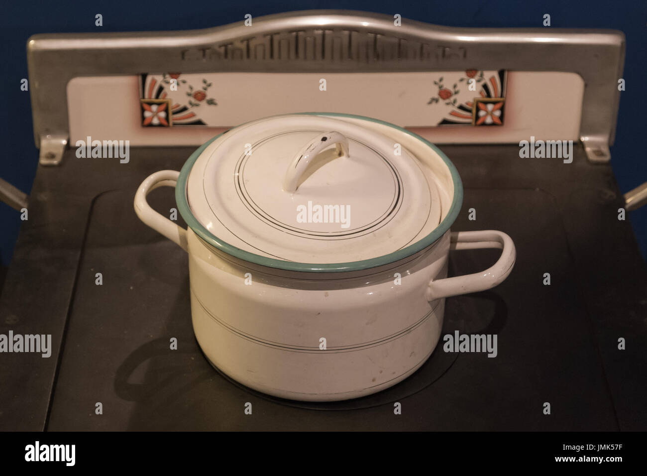 Old metal cooking pot in a vintage setting Stock Photo - Alamy