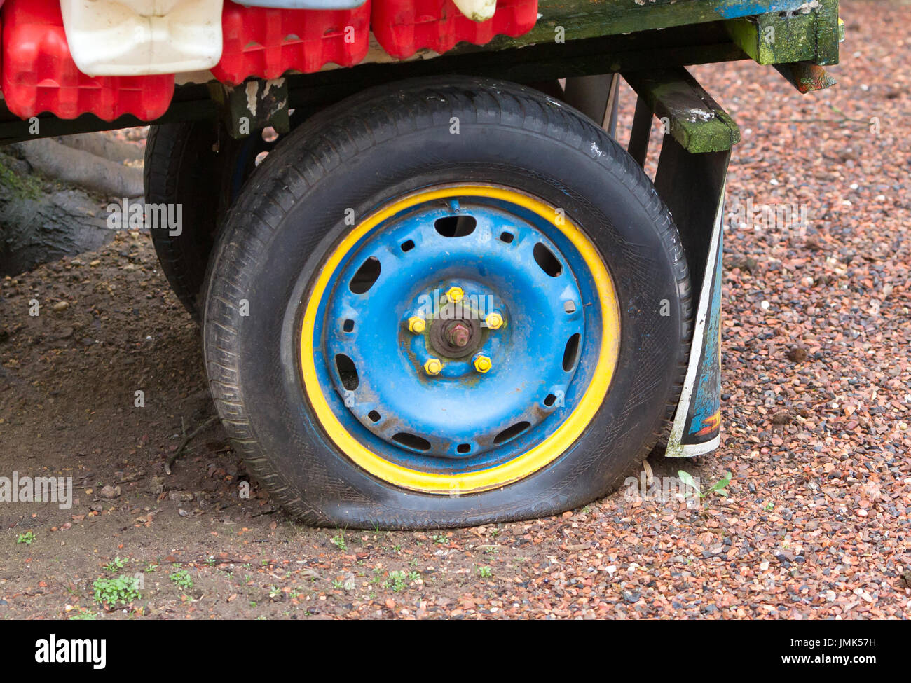 Flat rear tire on a colorful truck Stock Photo - Alamy