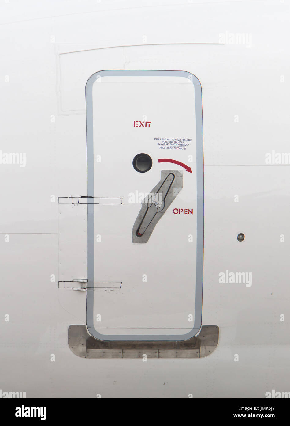 Emergency exit door in an old airplane Stock Photo - Alamy