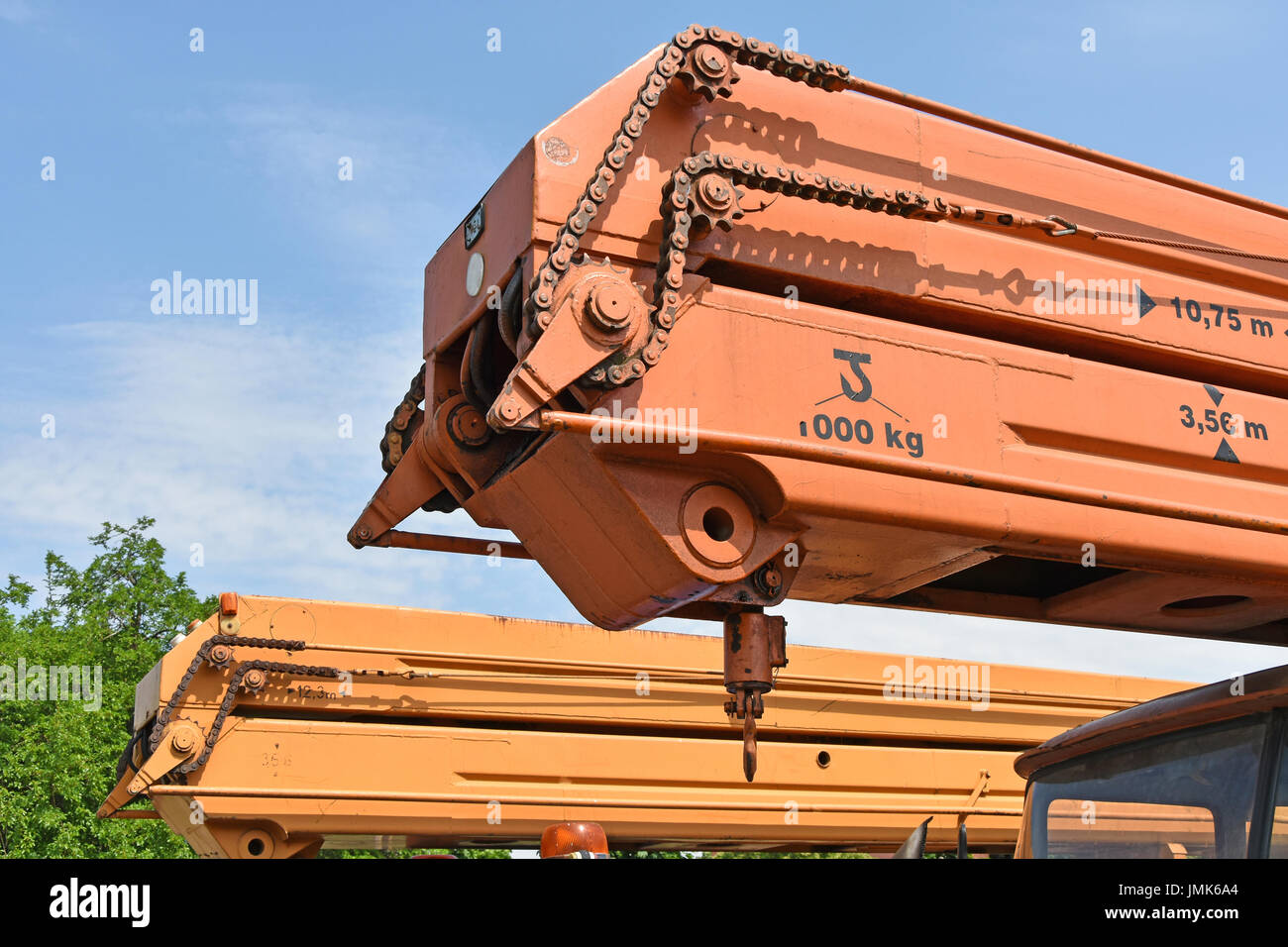 Chain drive of an old mobile crane vehicle Stock Photo - Alamy