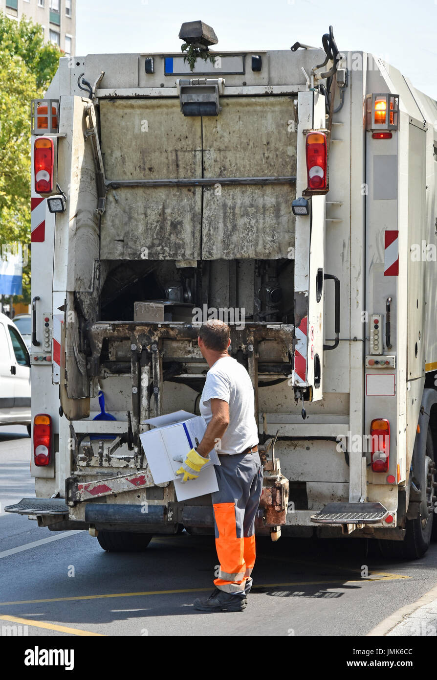 Garbage truck at work Stock Photo - Alamy