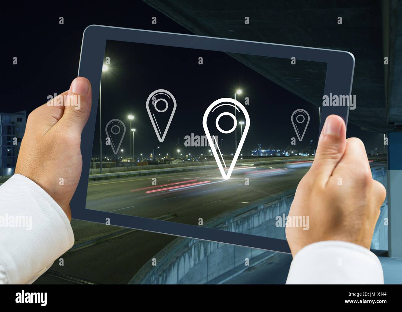 Digital composite of Holding tablet and Location pointer markers on ...
