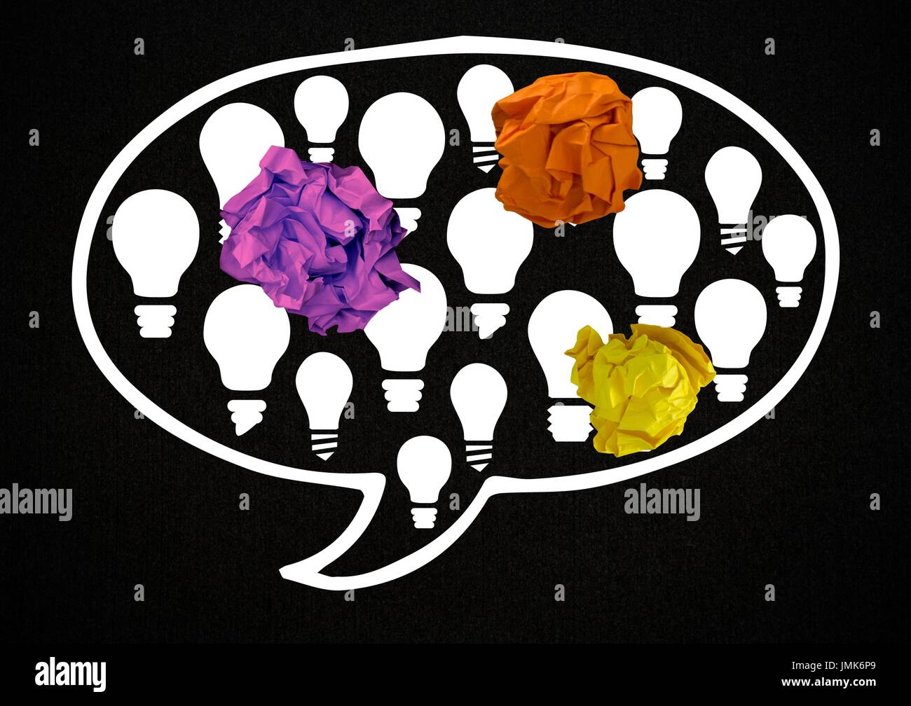 Digital composite of light bulb chat bubble with crumpled paper balls ...