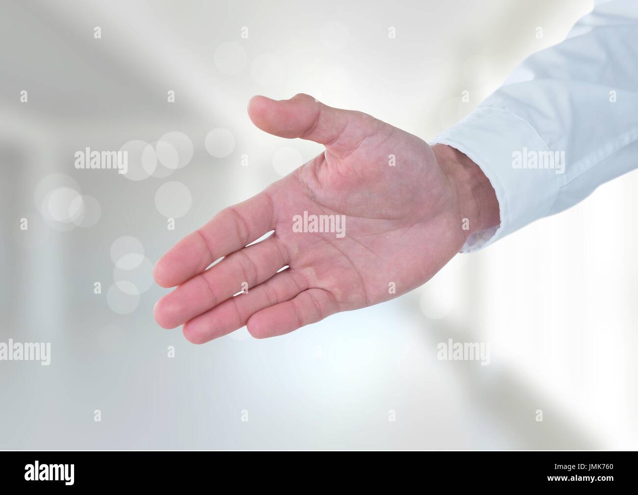 Digital composite of Business man stretching hand against white ...