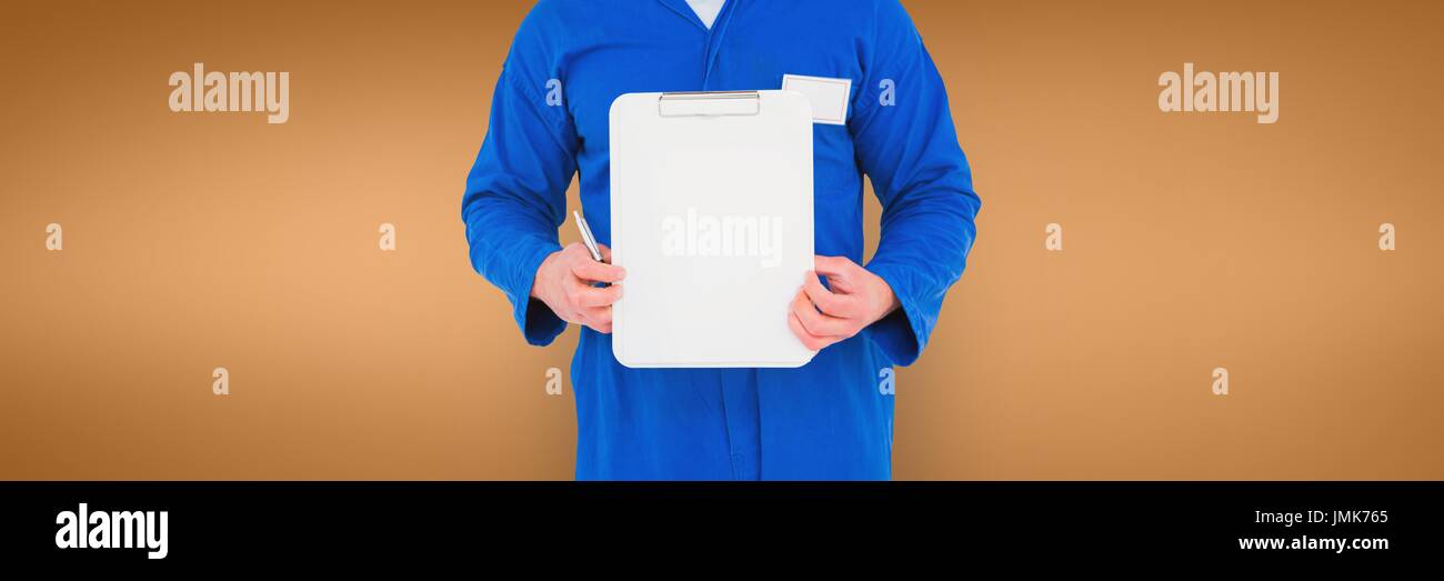 Digital composite of Mechanic man holding a file Stock Photo - Alamy