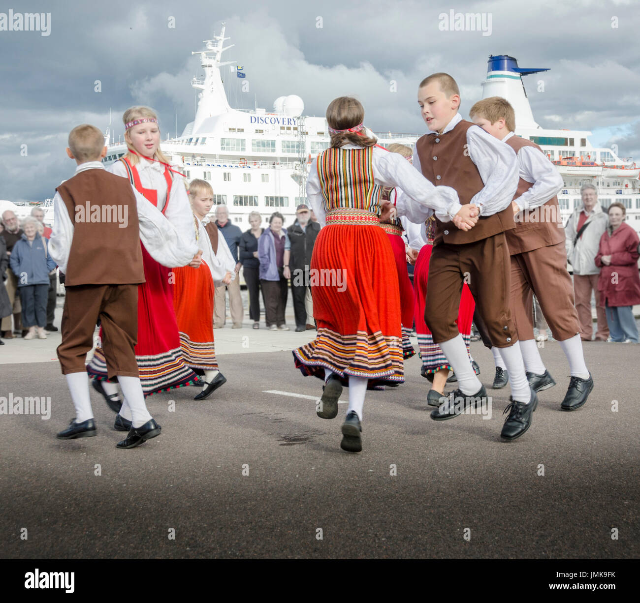 Children performing a traditional dance in Estonian national costume ...
