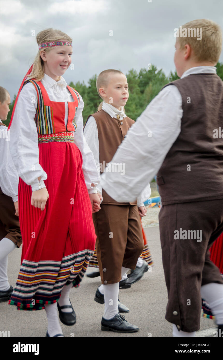 Children performing a traditional dance in Estonian national costume ...