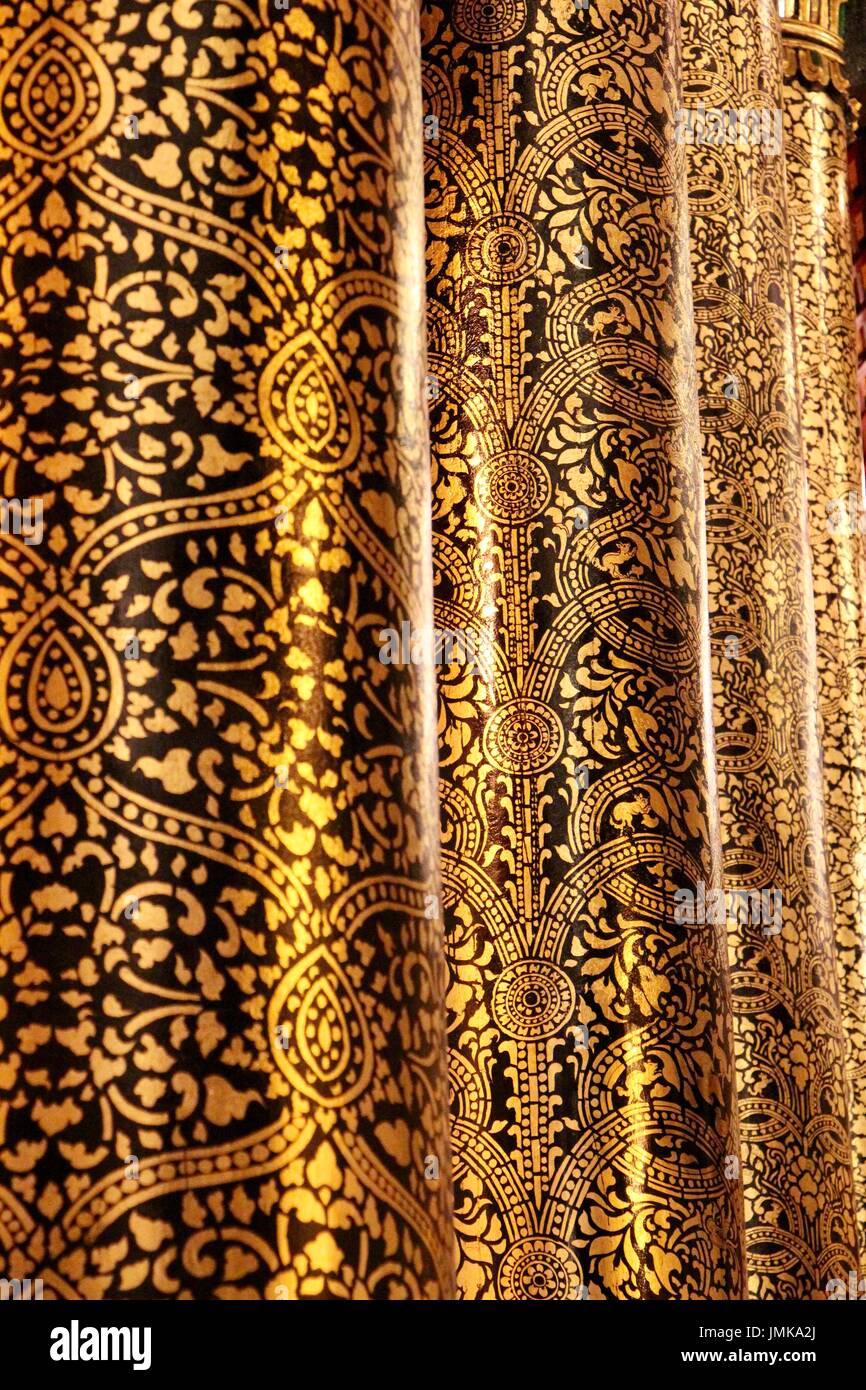 Intricate golden design on pillars at a Buddhist temple in Chiang Mai ...