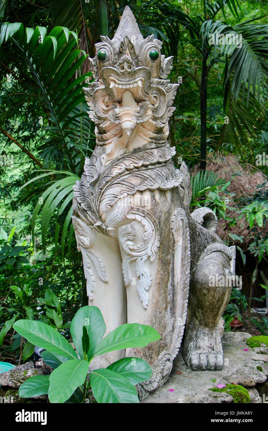 Dog statue at a Buddhist temple in Chiang Mai, Thailand Stock Photo - Alamy