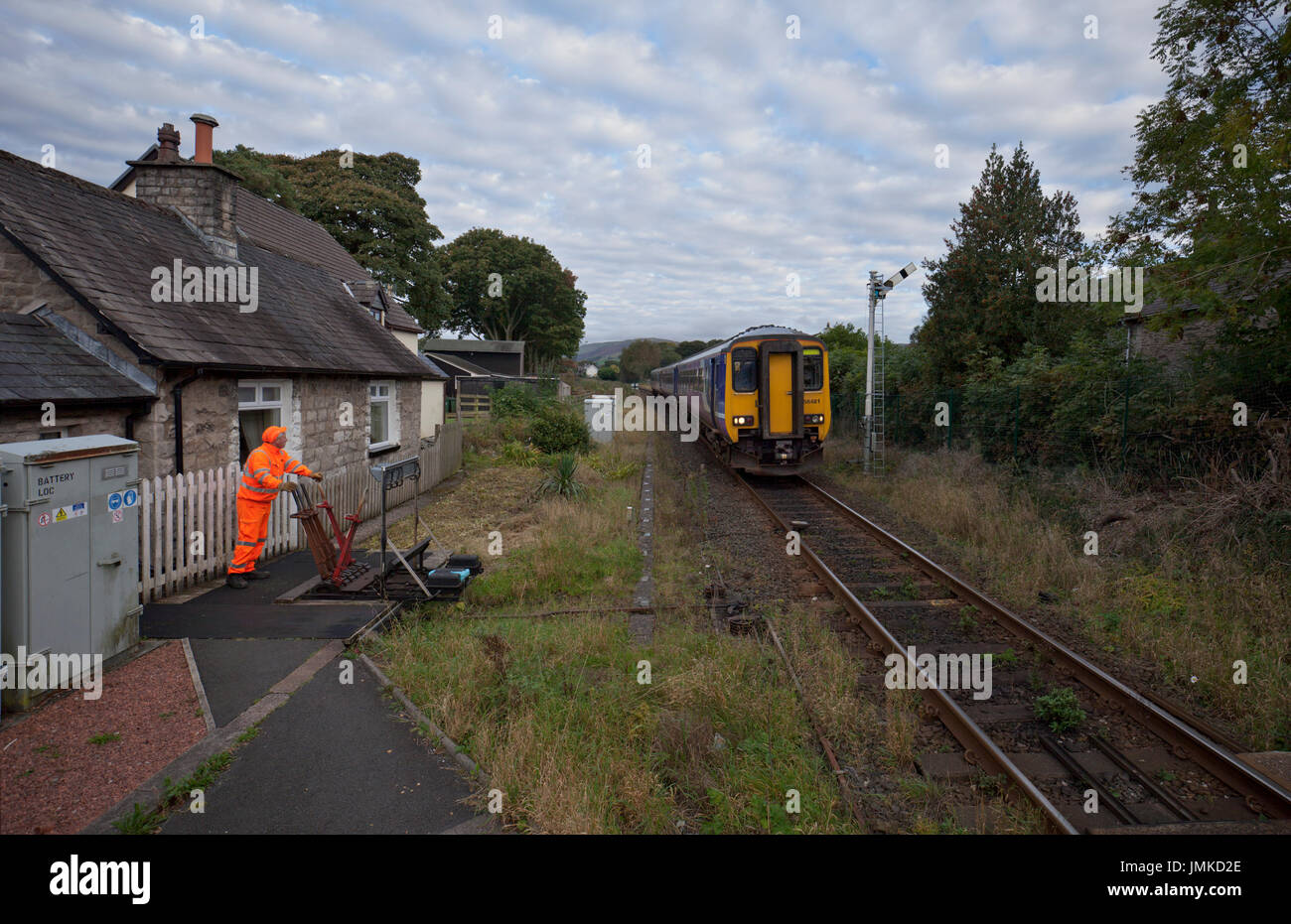 The 0850 Windermere - Oxenholme Northern rail train passes the crossing ...