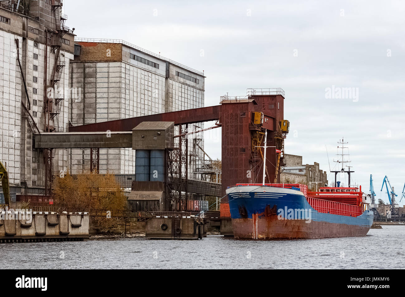 Blue cargo ship loading in the port of Riga, Europe Stock Photo - Alamy