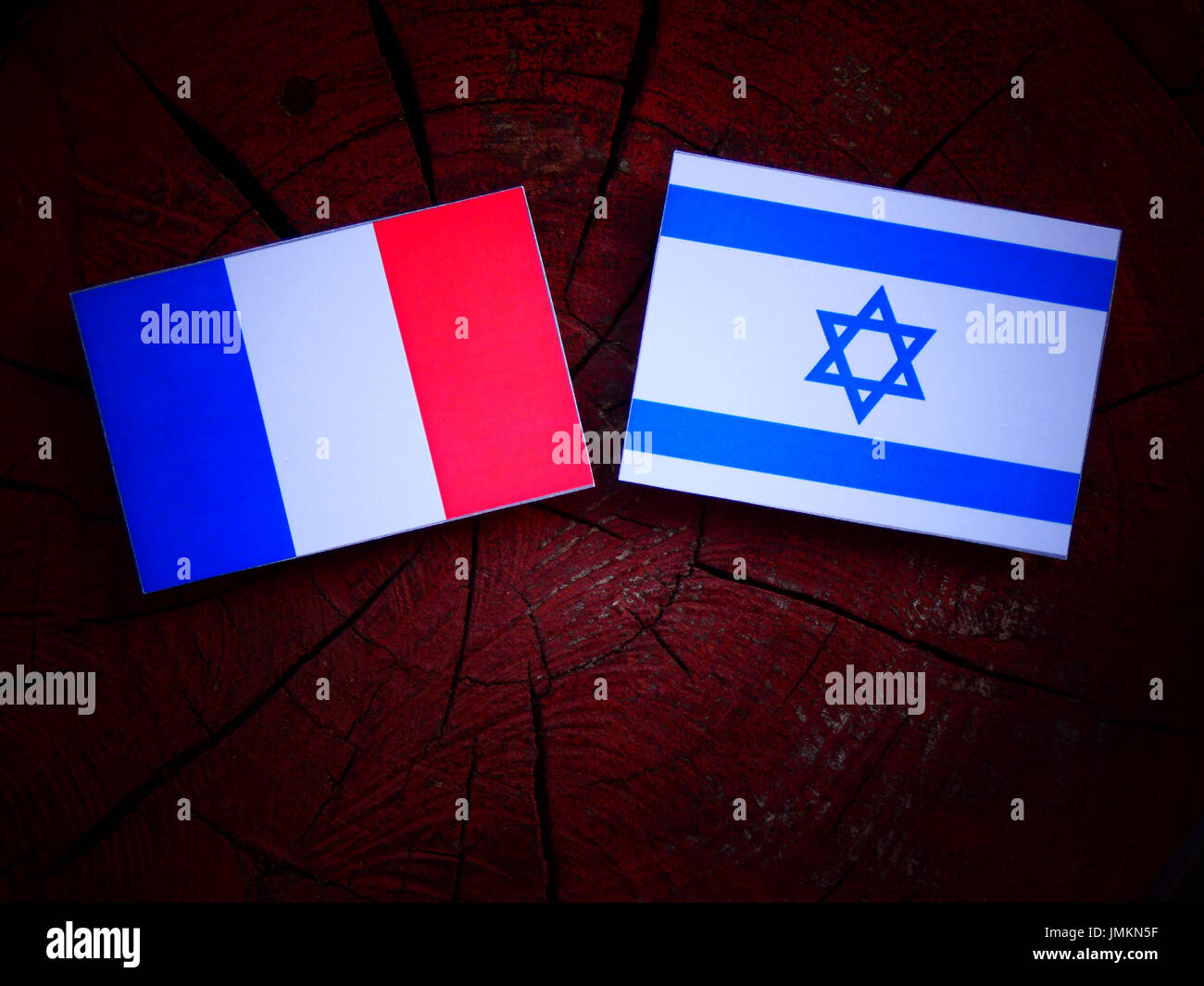 French flag with Israeli flag on a tree stump isolated Stock Photo - Alamy