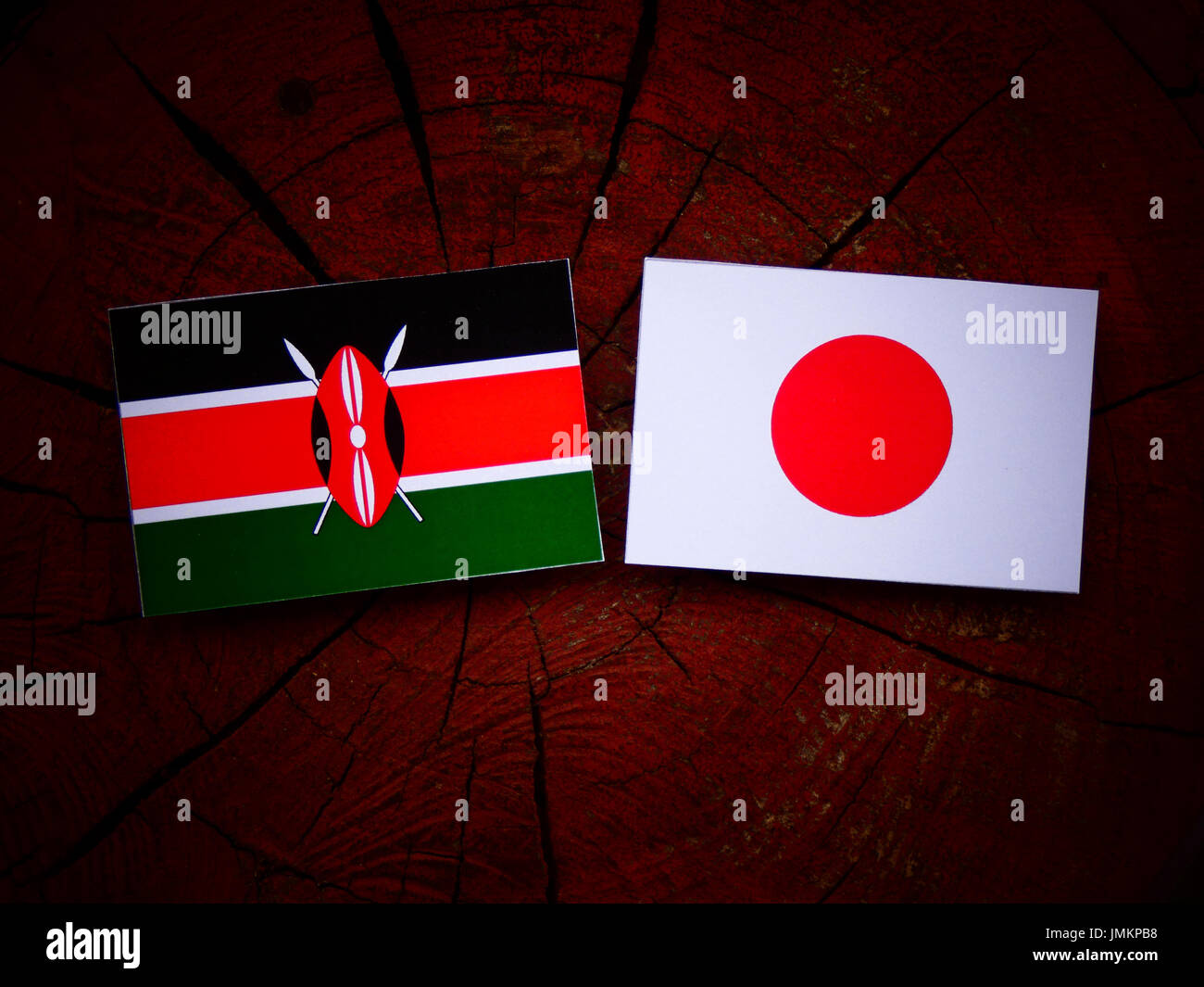 Kenyan flag with Japanese flag on a tree stump isolated Stock Photo - Alamy