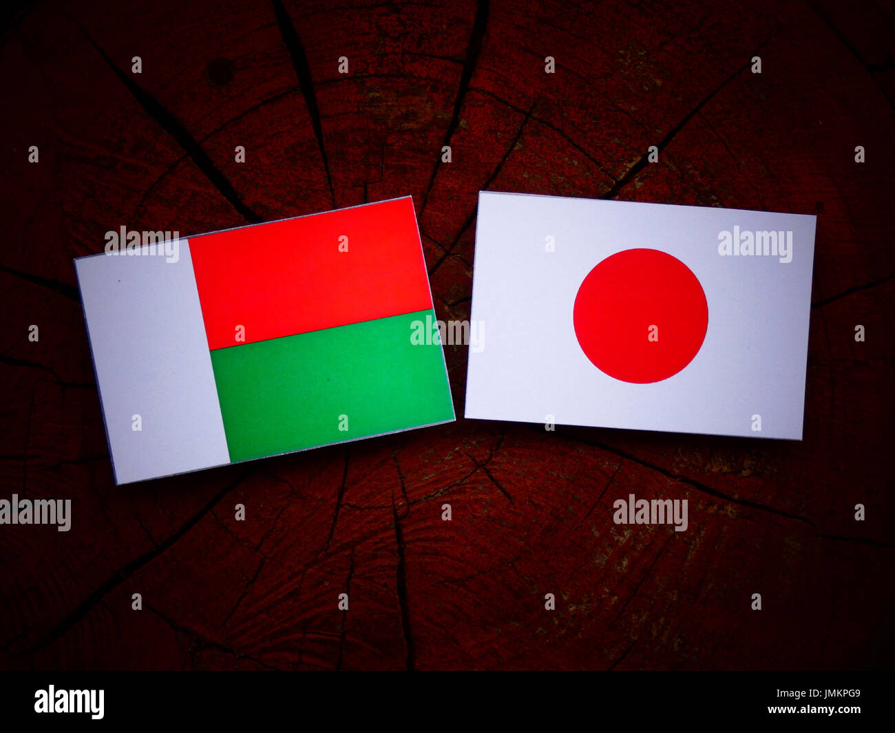 Madagascar flag with Japanese flag on a tree stump isolated Stock Photo ...